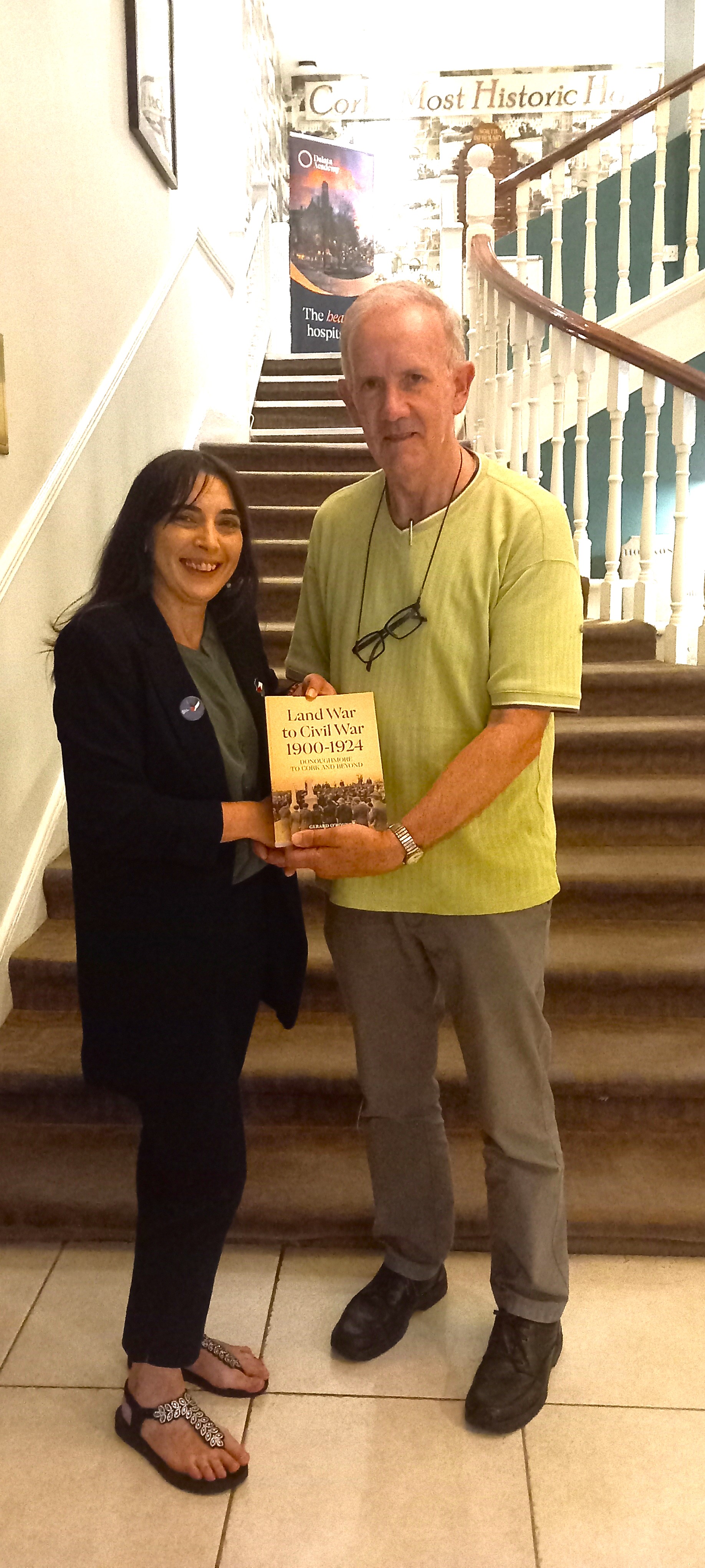 Author Gerard O’Rourke presenting historian Liz Gillis with a copy of ...